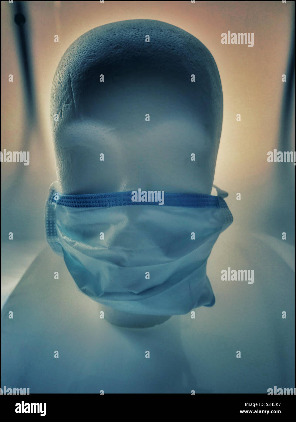 Surgical mask on mannequin head Stock Photo - Alamy