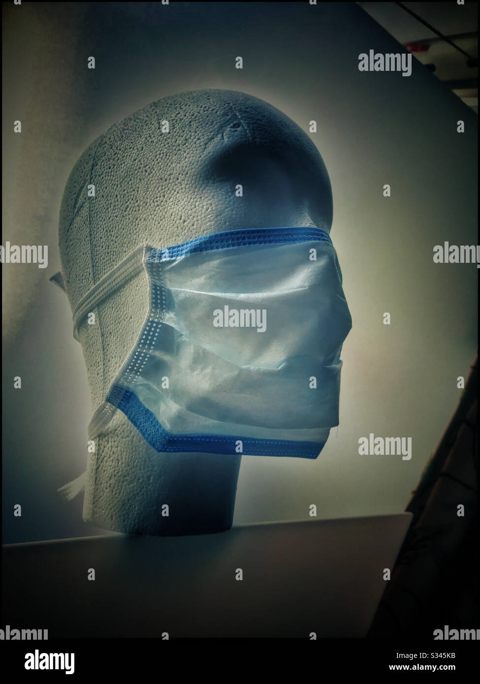 Surgical mask on mannequin head Stock Photo - Alamy