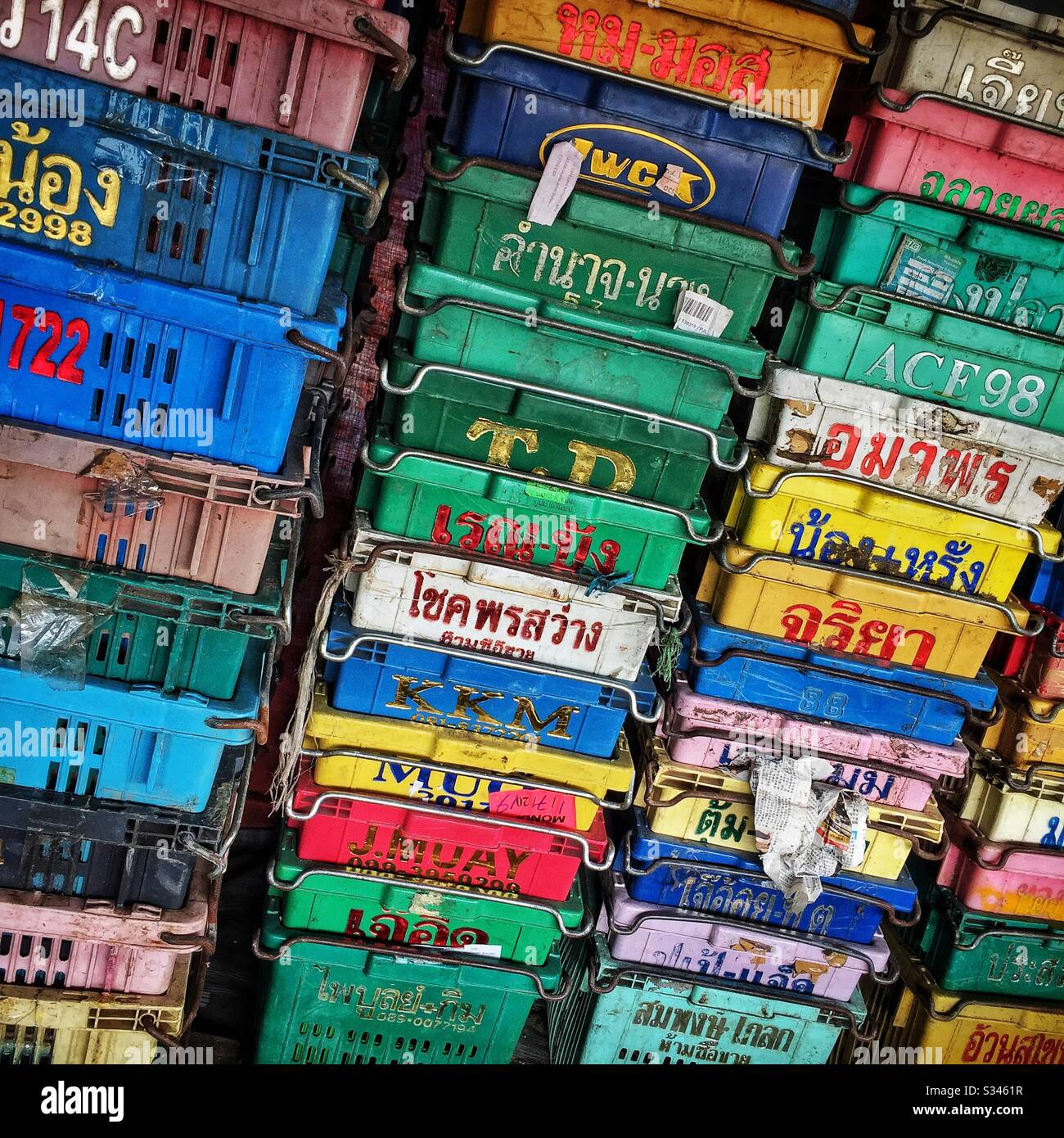 Stacks of plastic produce bins at a roadside stall, Kampung Kuala Kuang ...