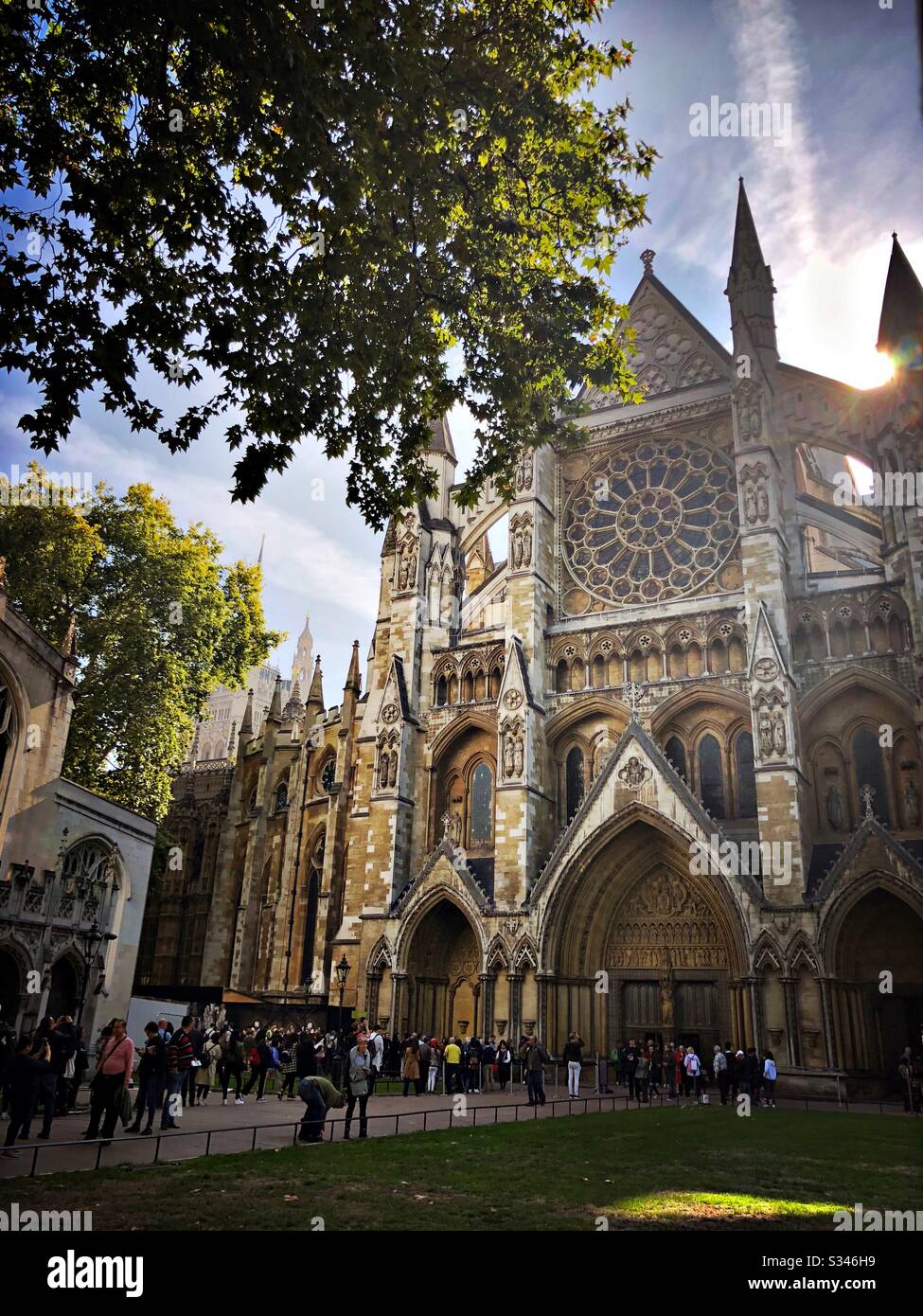 A backlit view of the North entrance facade of Westminster Abbey ...