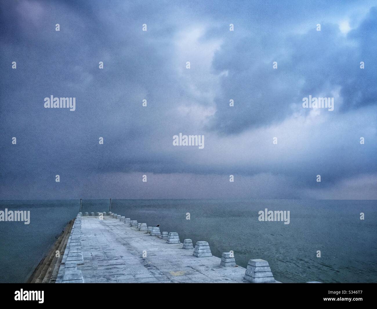 A morning rain squall over the ocean at Batu Ferringhi, Penang ...