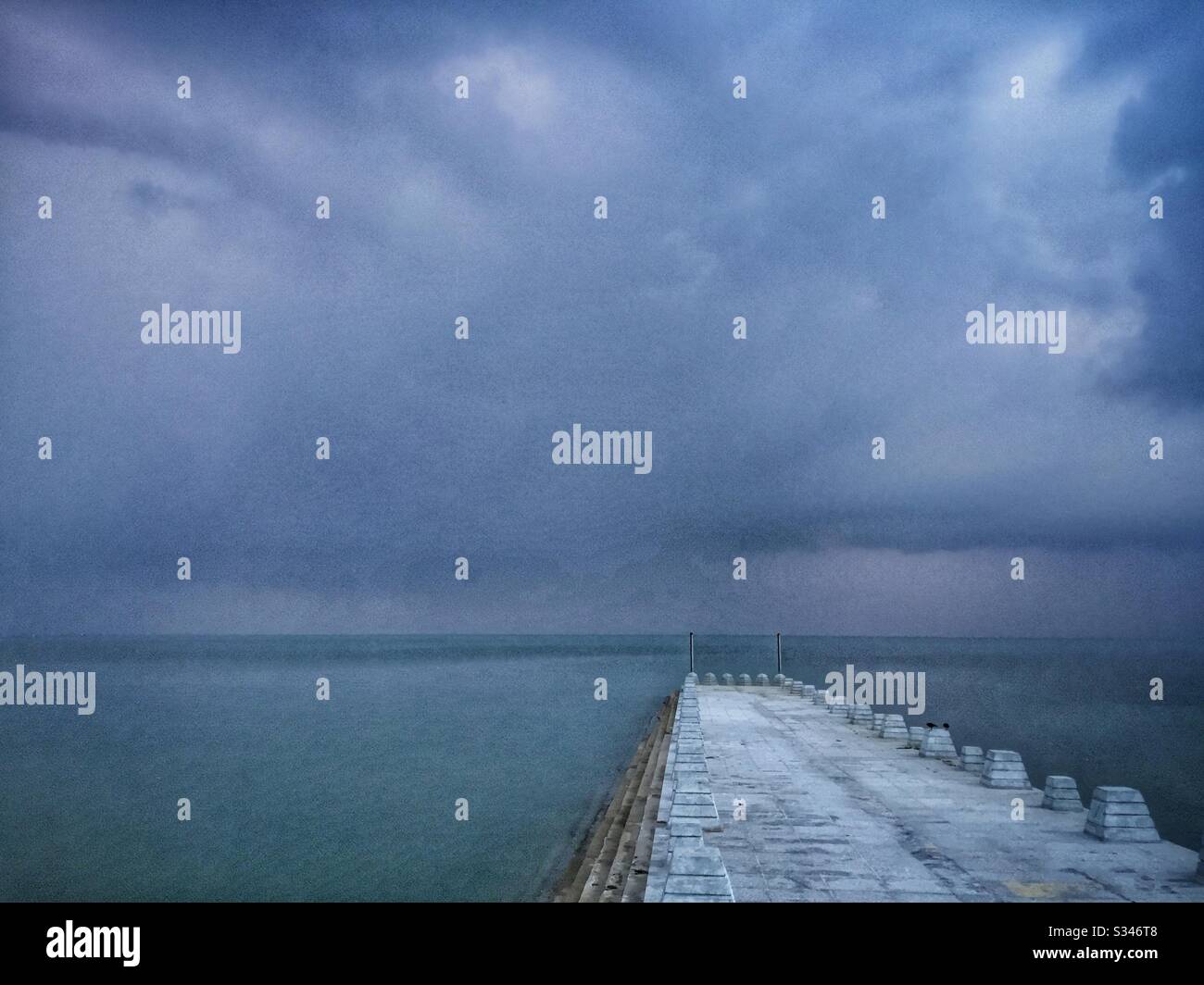 A morning rain squall over the ocean at Batu Ferringhi, Penang ...