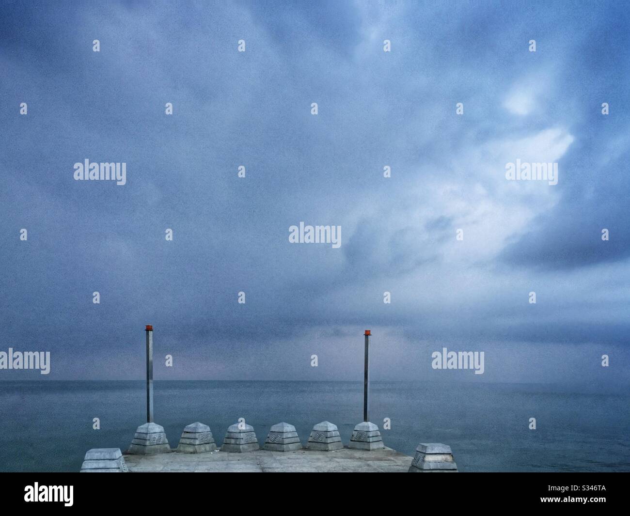 A morning rain squall over the ocean at Batu Ferringhi, Penang ...