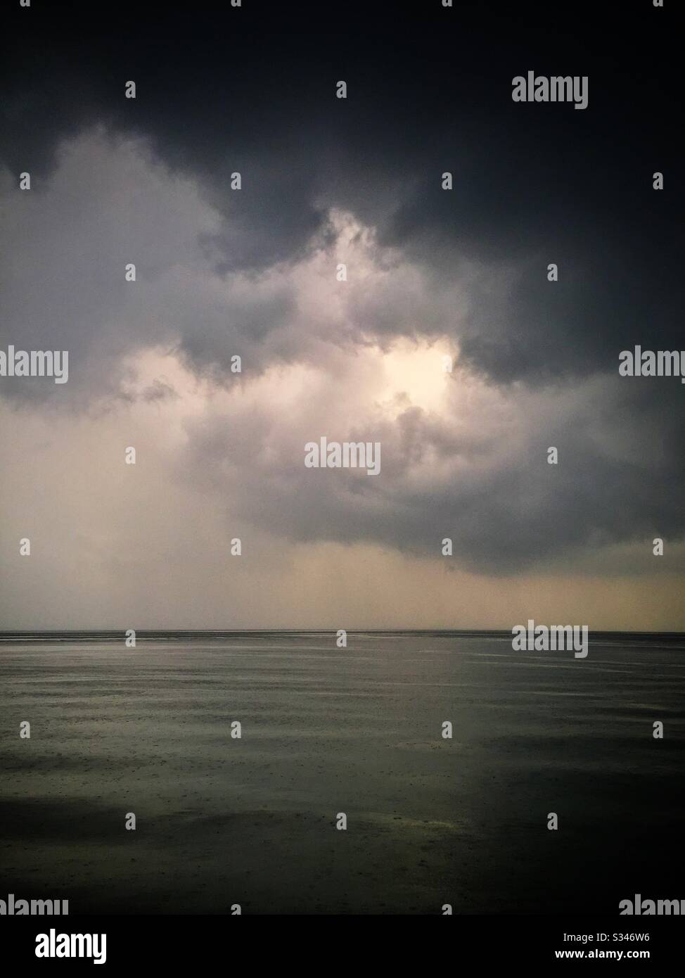 A morning rain squall over the ocean at Batu Ferringhi, Penang ...