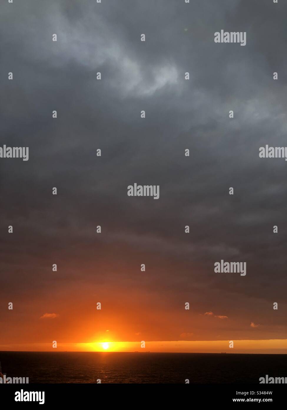 Cloudy skies over ocean hi-res stock photography and images - Alamy