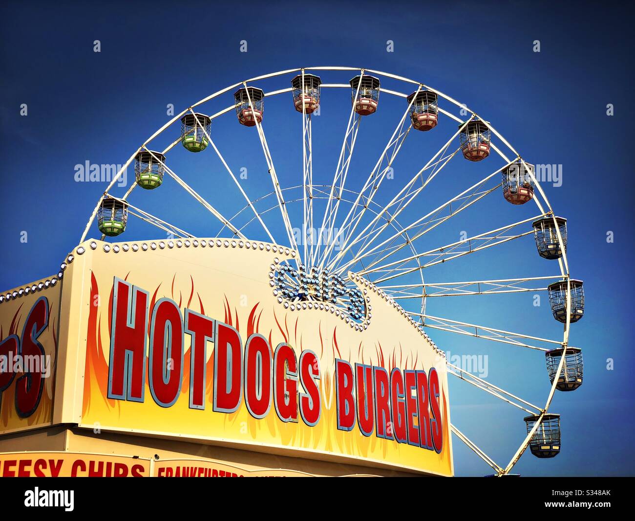 A retro hotdog and burger street food stall is seen at a travelling ...