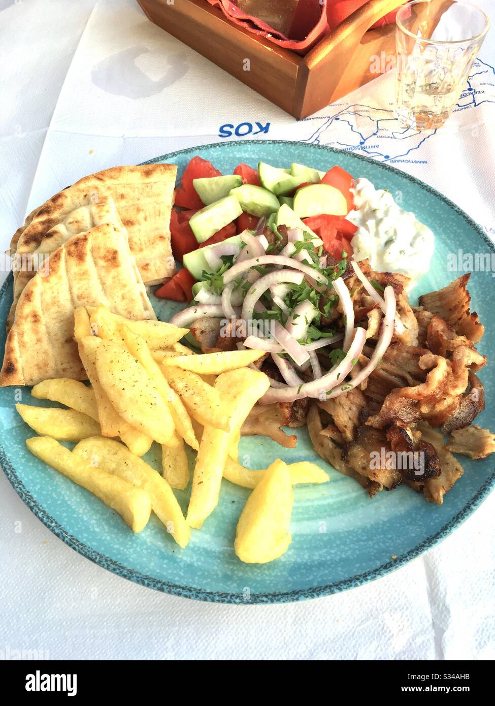 Greek gyros and chips meal Stock Photo - Alamy