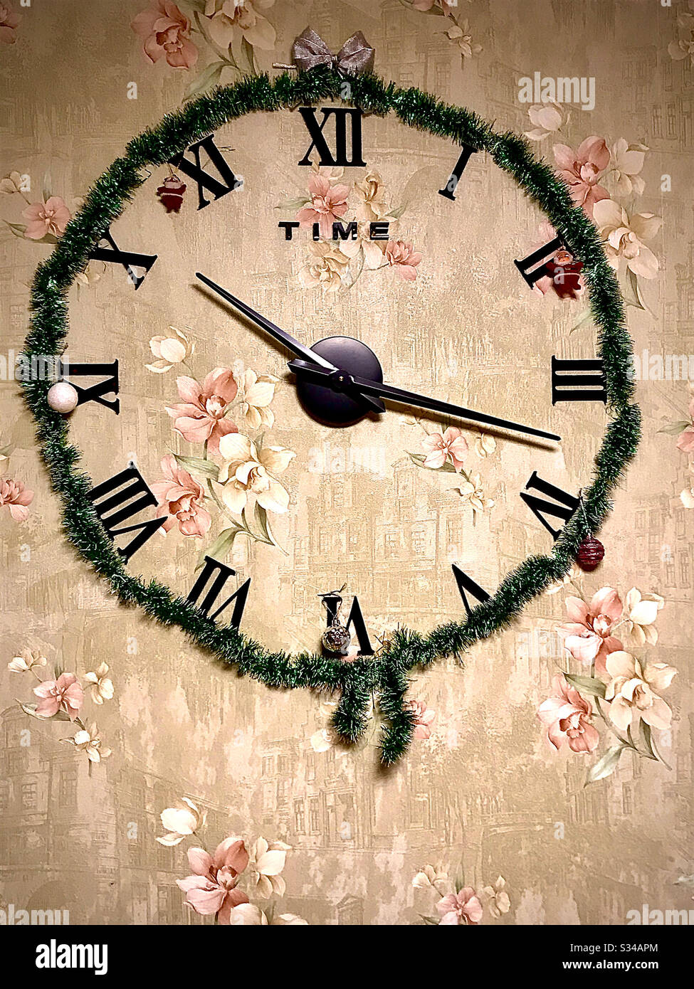 Festive decoration of wall clocks Stock Photo - Alamy