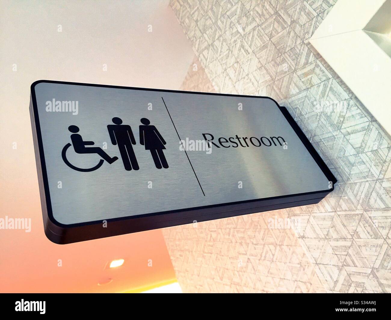 Sign above a public restroom that is unisex and ADA accessible, USA ...