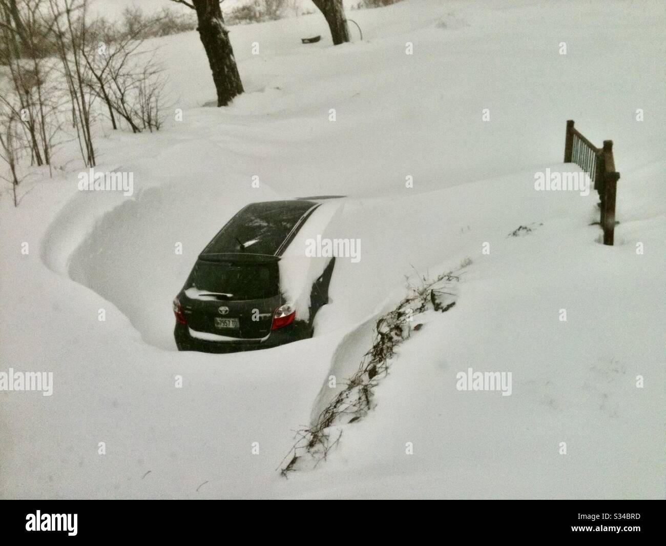 Car buried in a snowdrift on a driveway in New England Stock Photo - Alamy