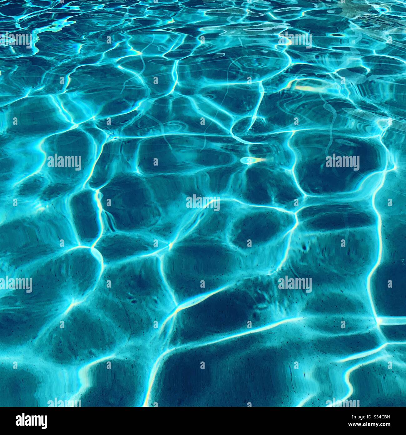 Sunlight on the water at a hotel pool Stock Photo - Alamy