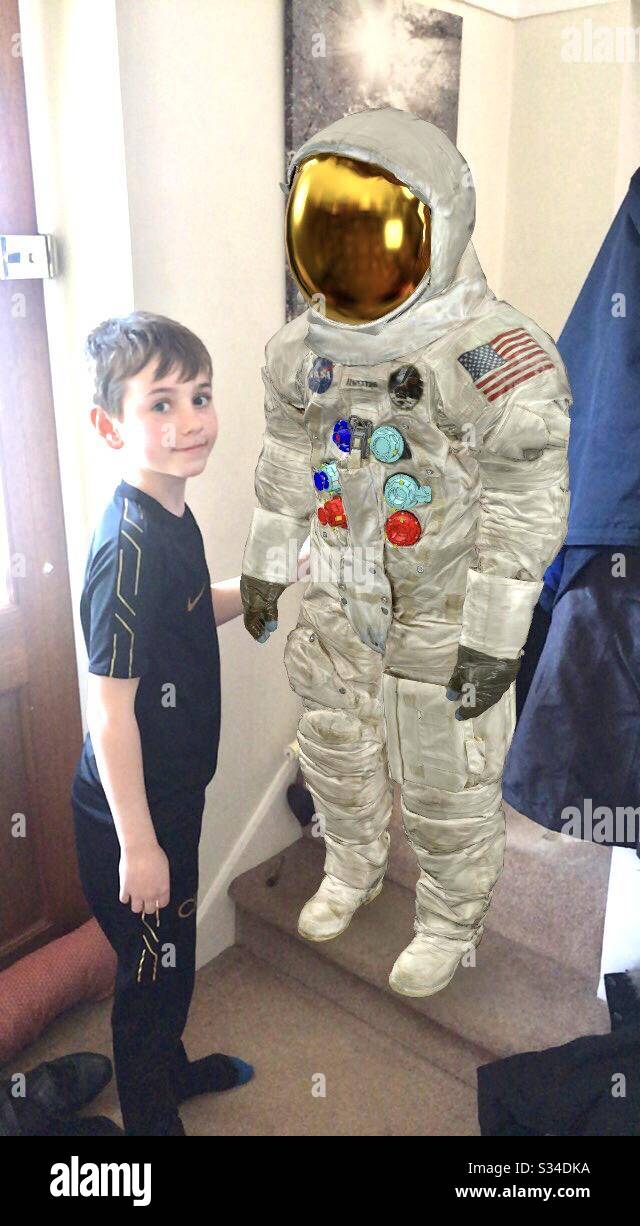Boy with spaceman in house Stock Photo - Alamy