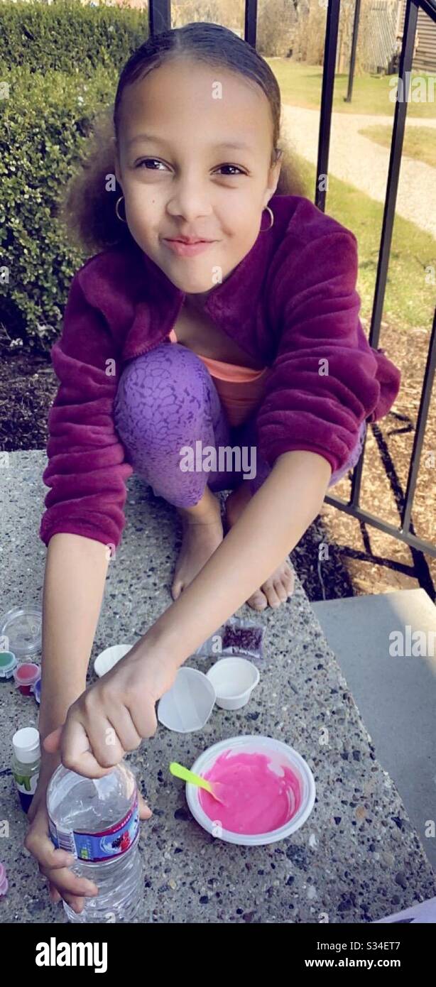 Little girl making slime Stock Photo - Alamy