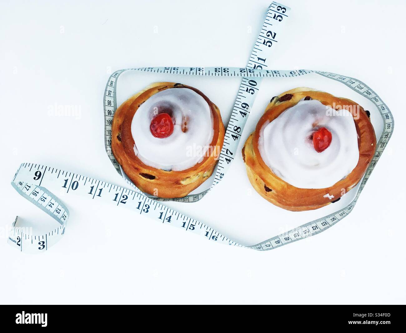 Belgian iced buns with tape measure Stock Photo - Alamy