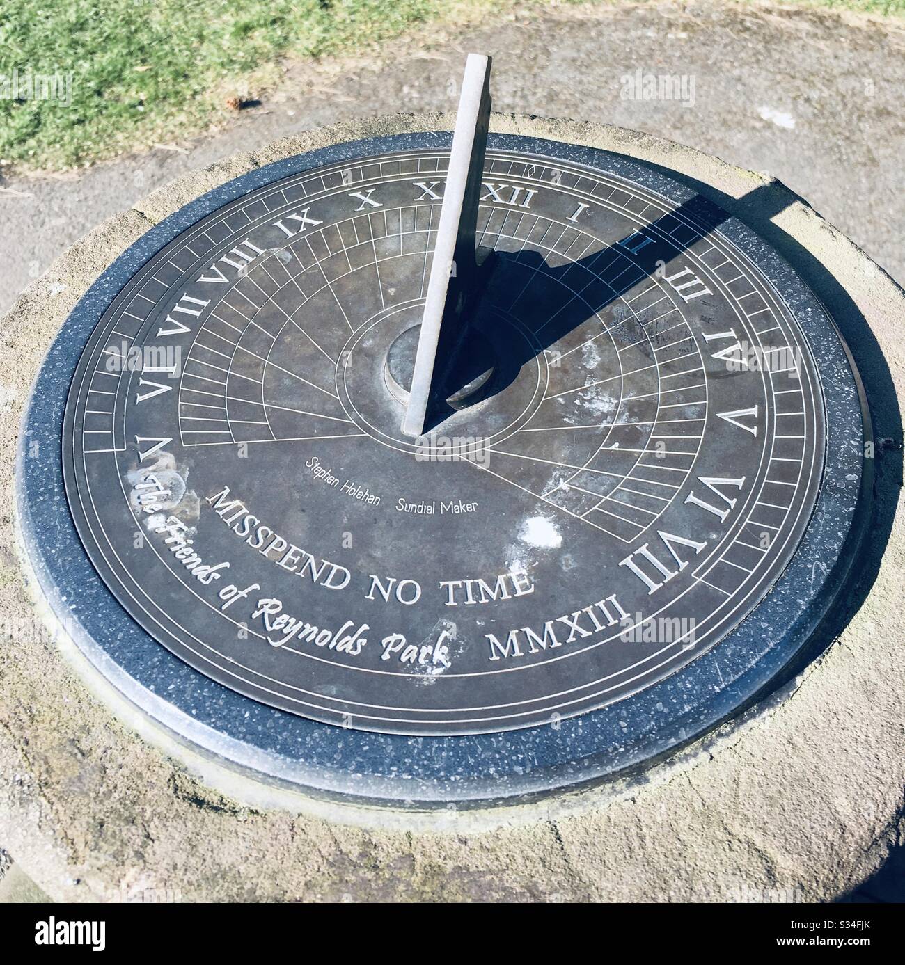 Sundial in park Stock Photo - Alamy