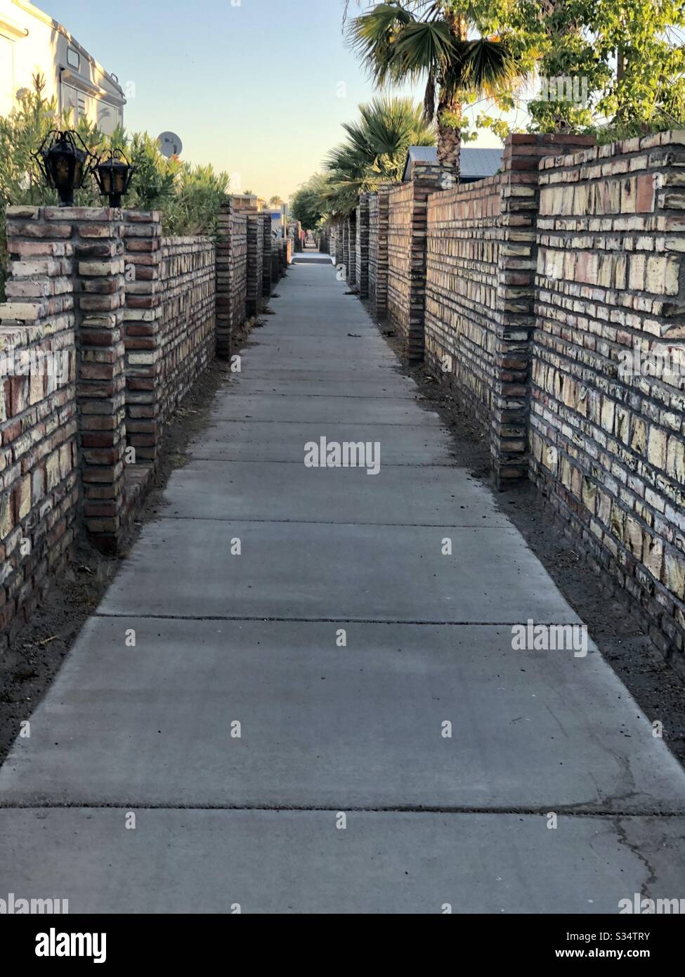 Walkway, walking trail, many streets long, brick walls, cement path ...