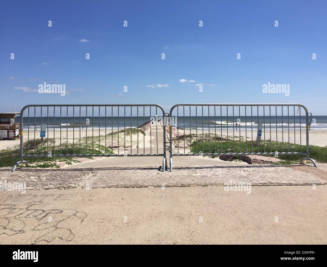 Barricade blocks one of many beach access ramps in Galveston, TX ...