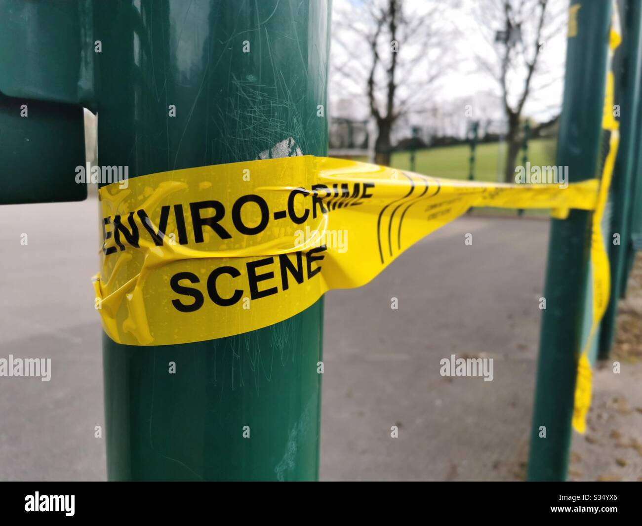 “Enviro crime scene” tape reverting access to a play area within a park ...
