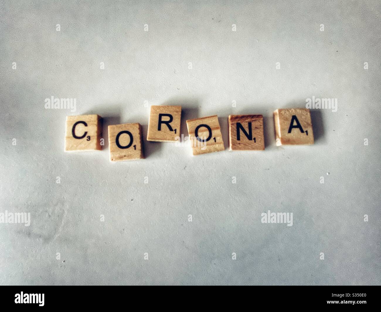 Corona written in tile letters Stock Photo - Alamy