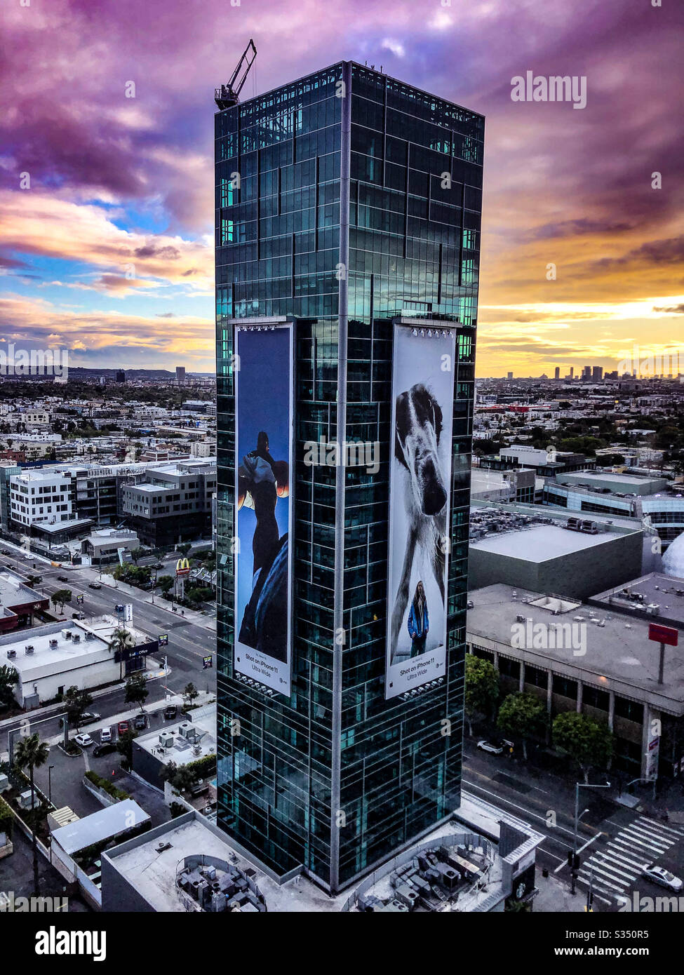 Tall building with colorful sky Stock Photo - Alamy