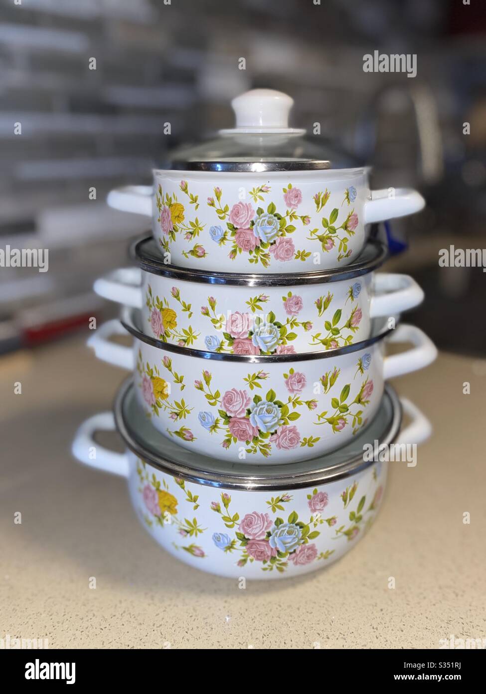 Beautiful set of colourful cooking pots Stock Photo - Alamy