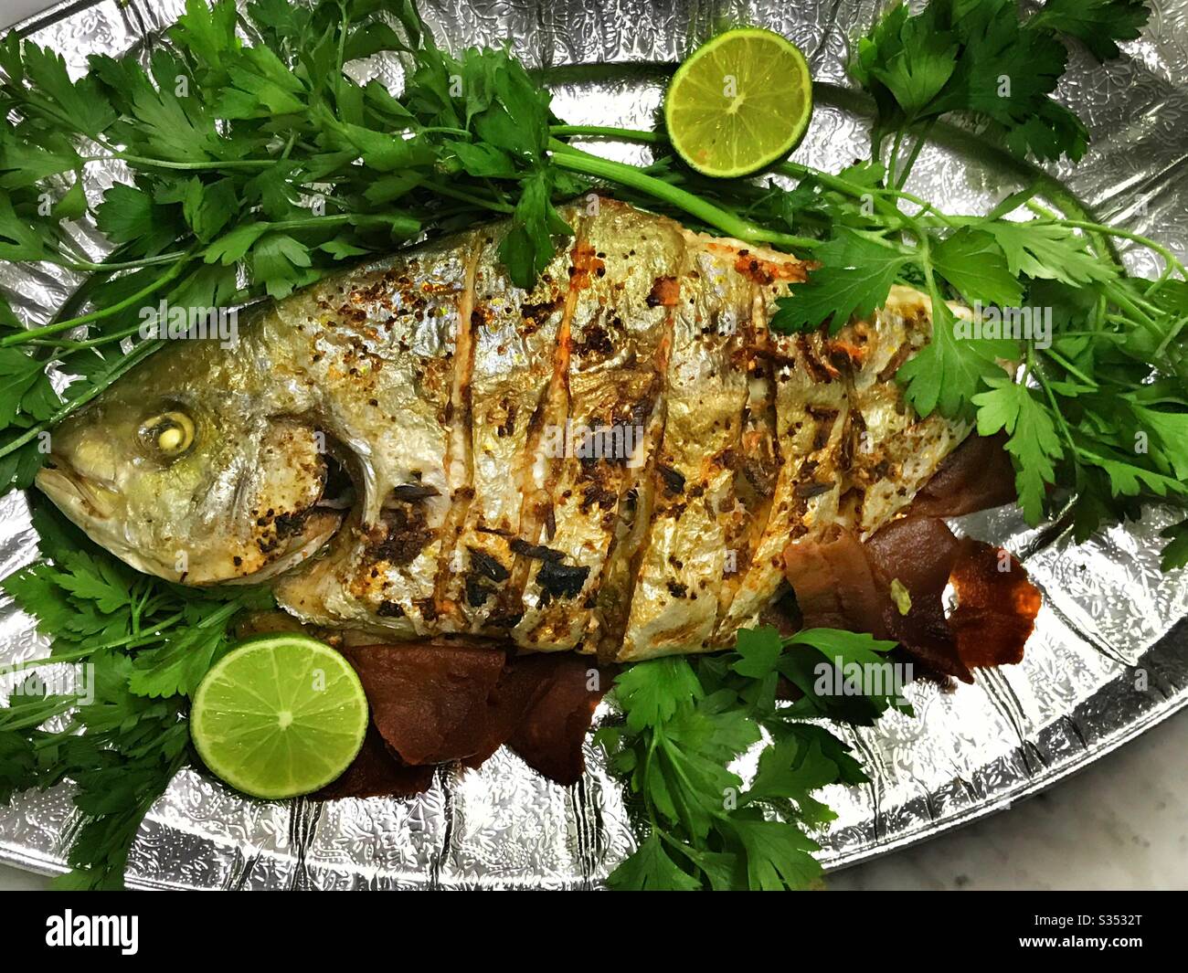 Ready to eat fish: oven cooked fish with some decorations Stock Photo ...