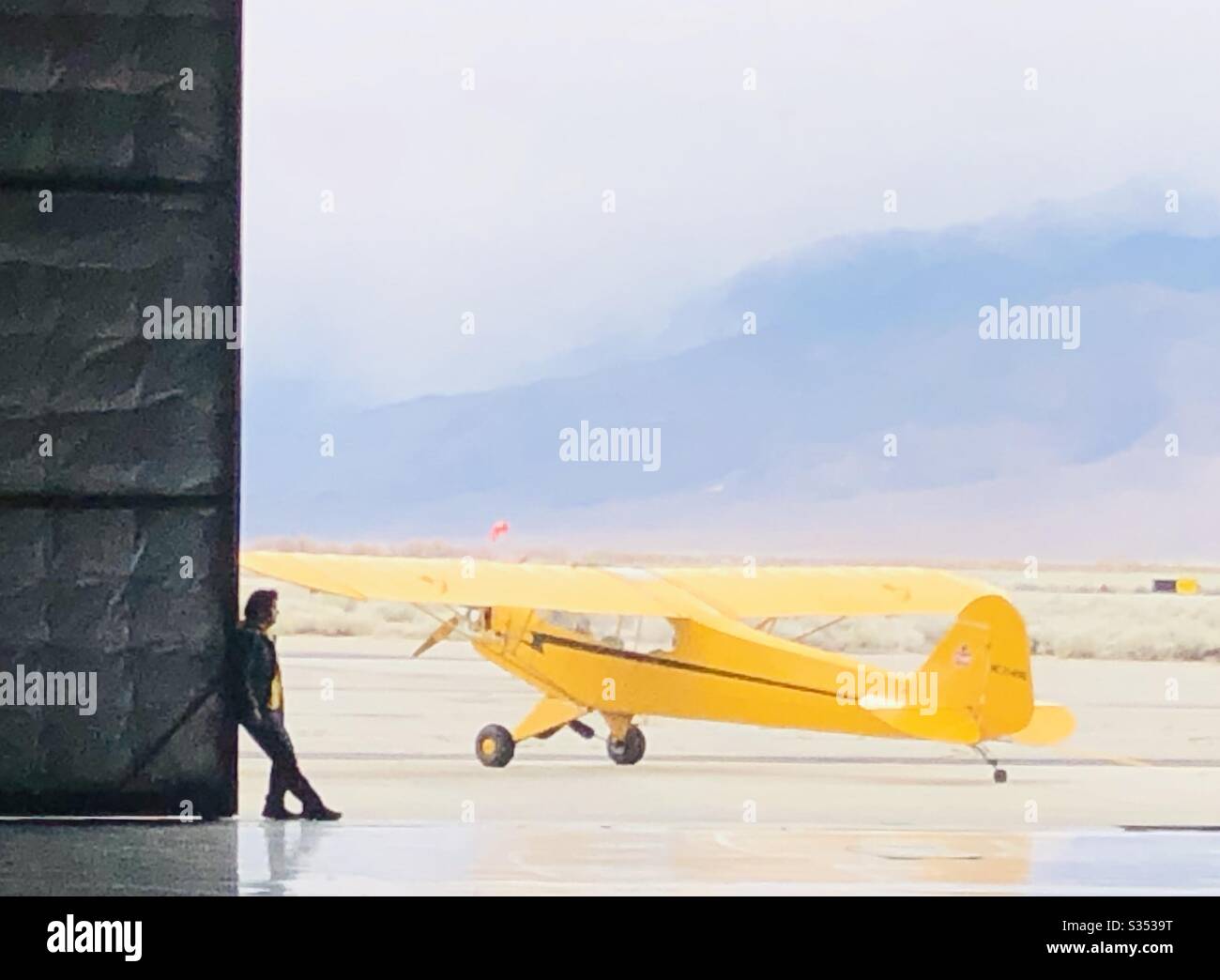 Piper Cub 1934. Pilot and Cub at Bishop Airport, California, USA Stock ...