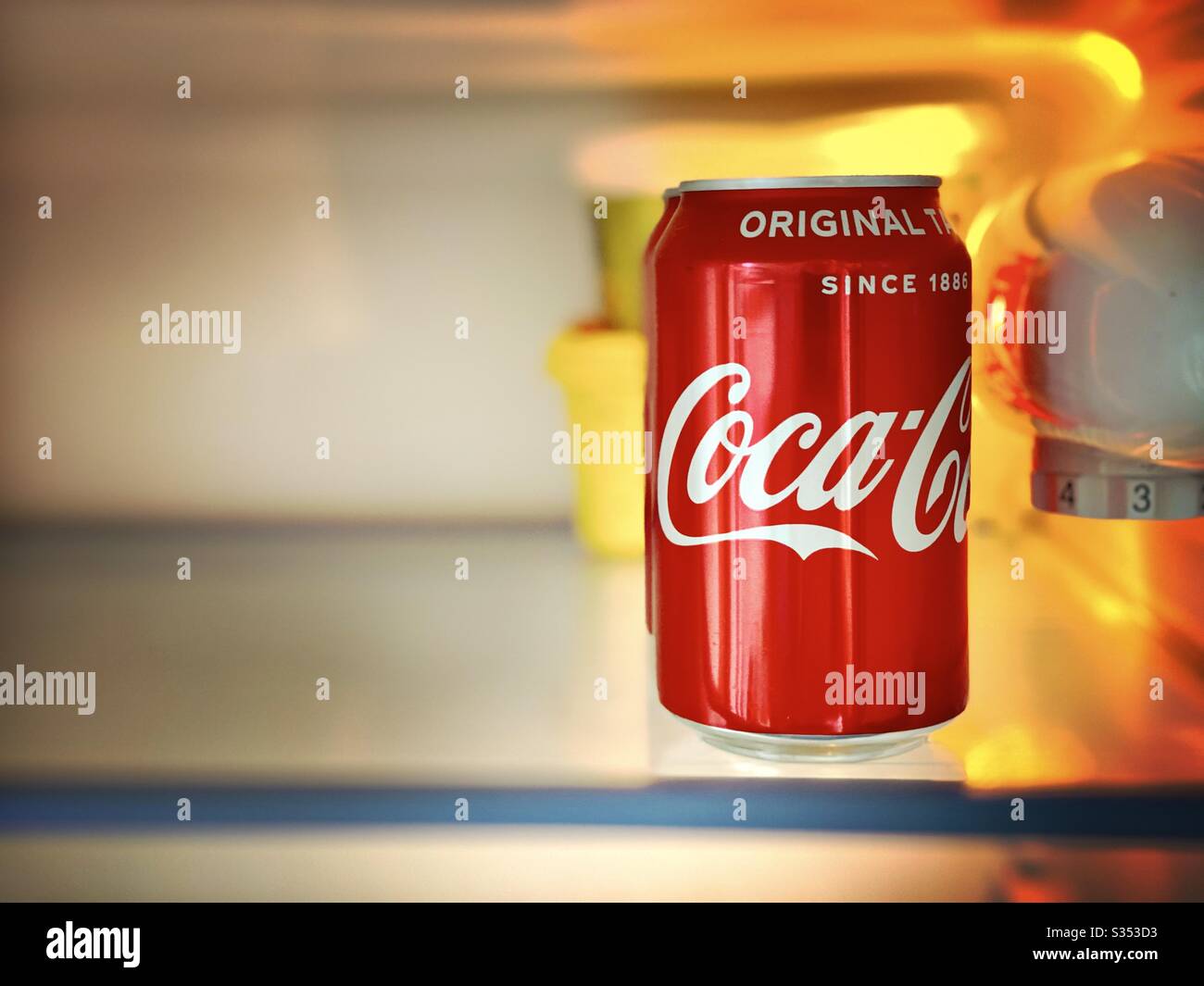 Tins of Coca Cola in the refrigerator, backlit with copy space Stock ...