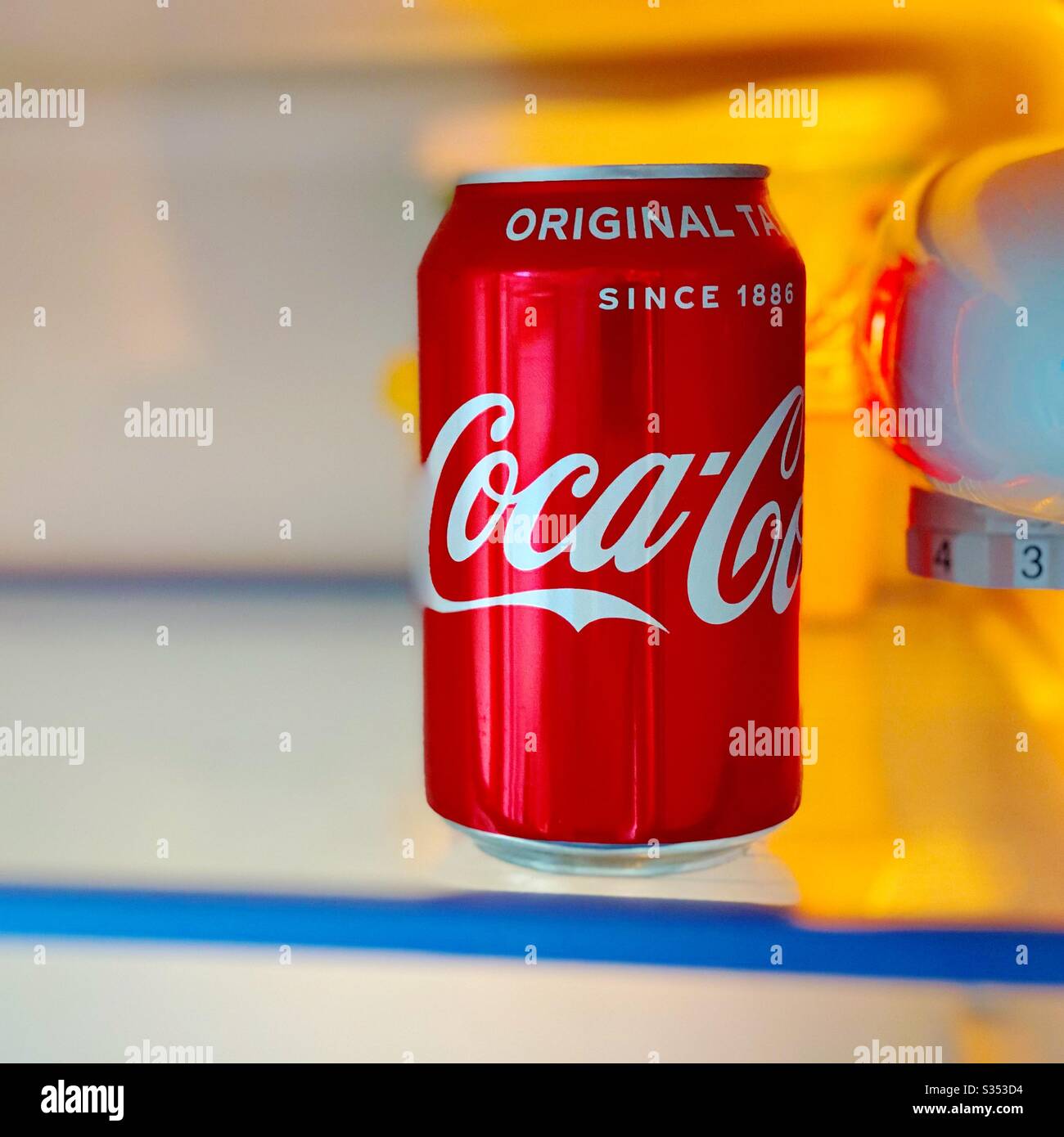 Tins of Coca Cola in the refrigerator, backlit with copy space Stock ...