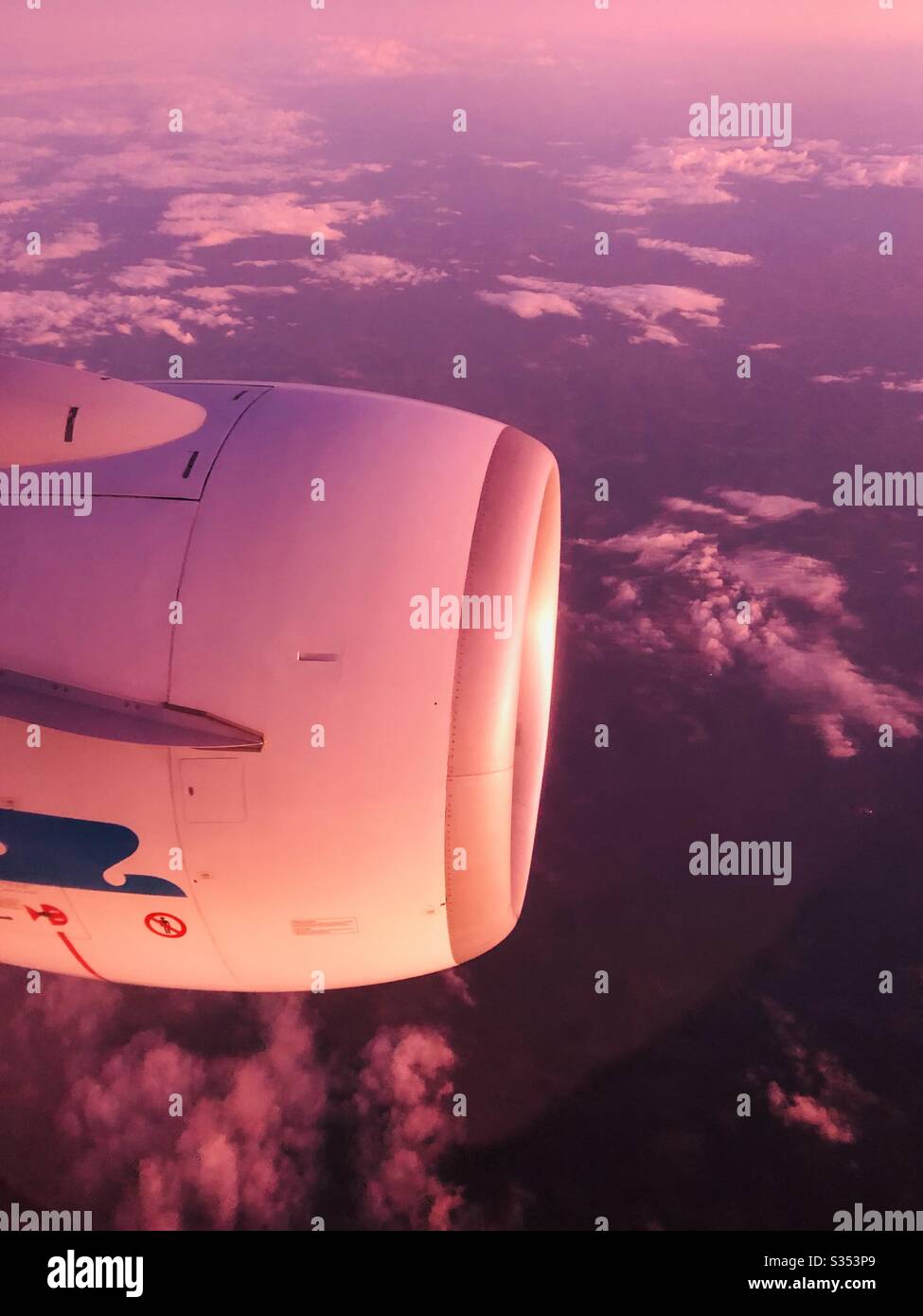 A stunning pink-hued sunset while airborne over Brazil Stock Photo - Alamy