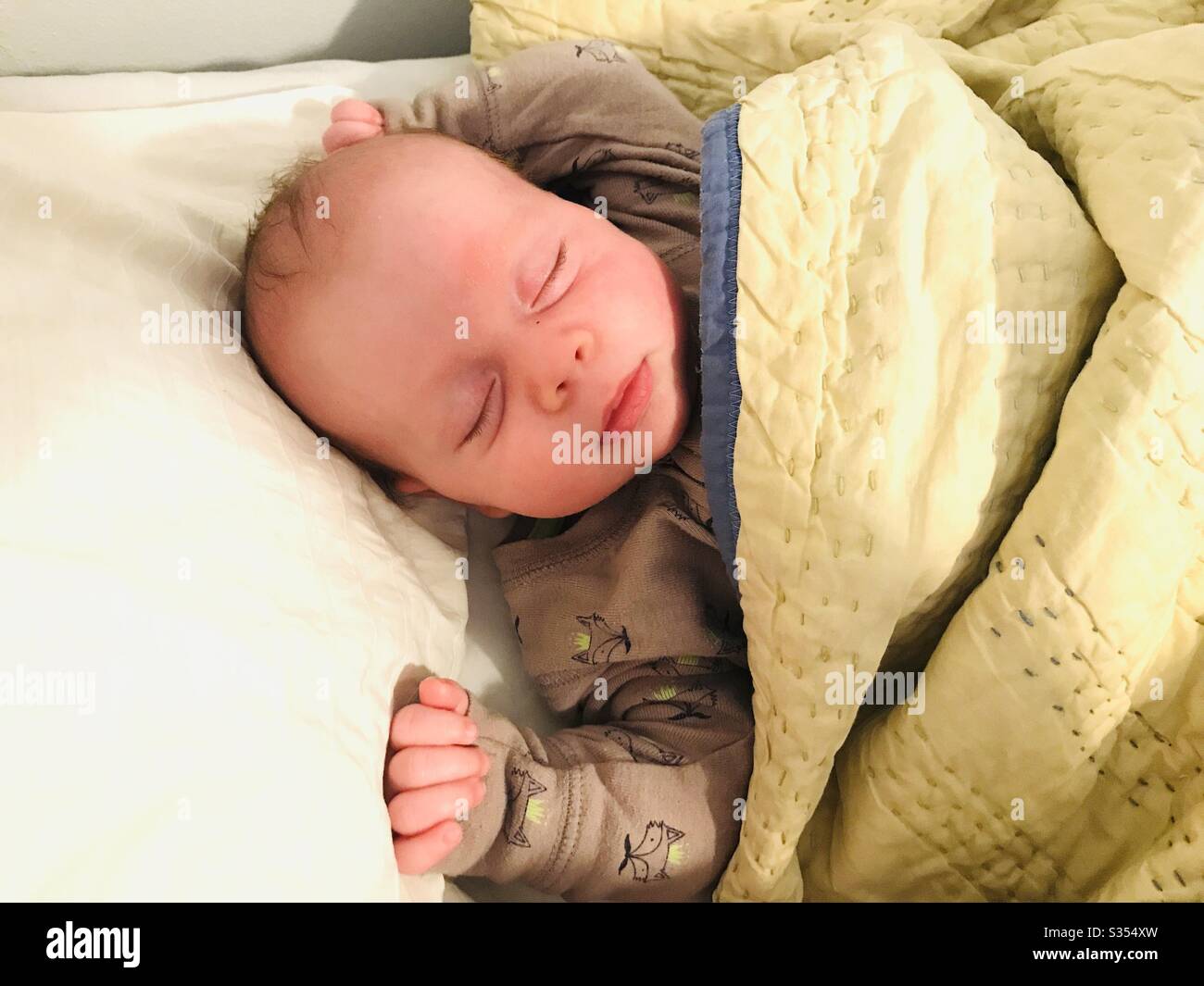 Adorable baby boy sleeping on hi-res stock photography and images - Alamy
