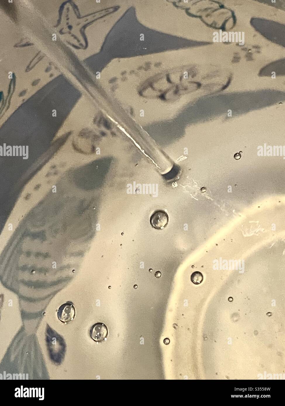 Pouring water bucket hi-res stock photography and images - Alamy