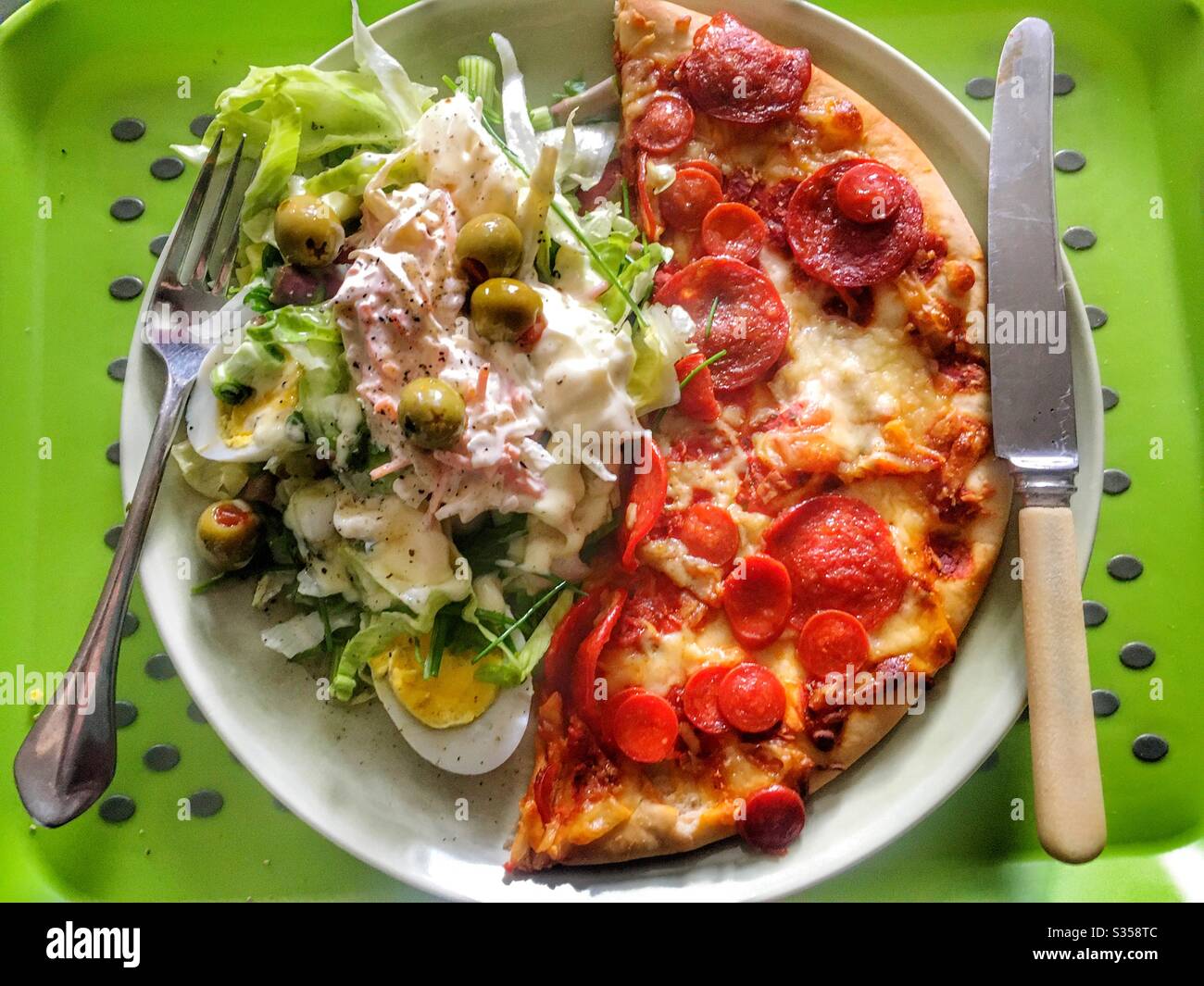 Double pepperoni pizza with salad Stock Photo - Alamy