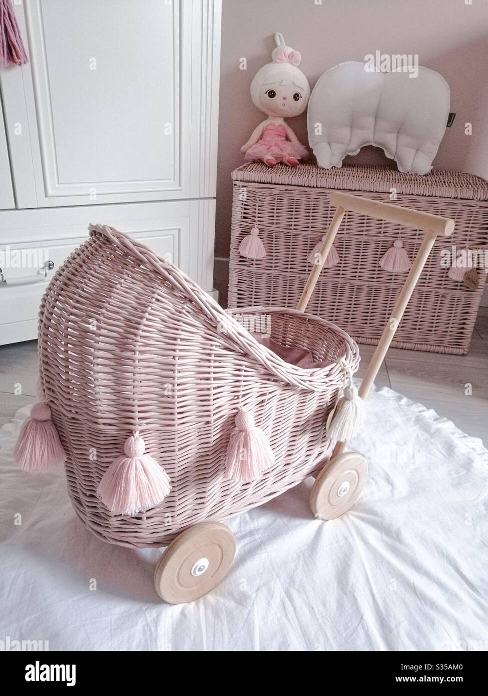 Pretty wicker truck in kids room Stock Photo - Alamy