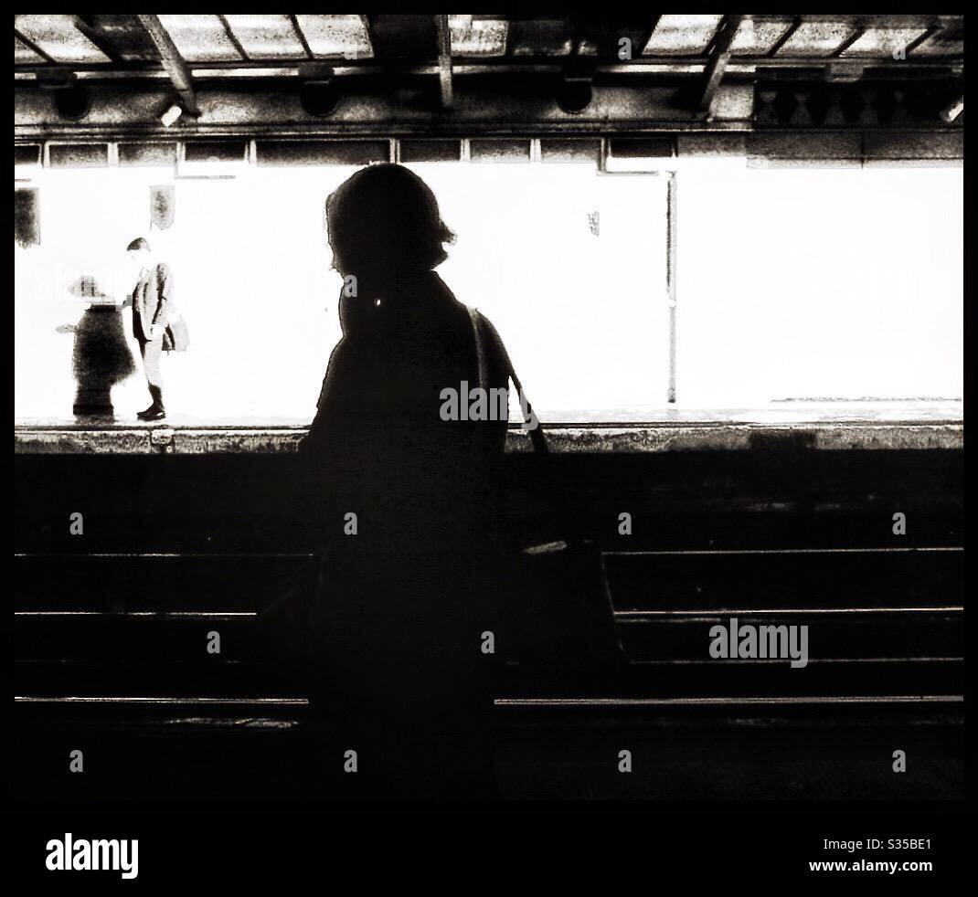 Shadows of commuters waiting for the train Stock Photo - Alamy