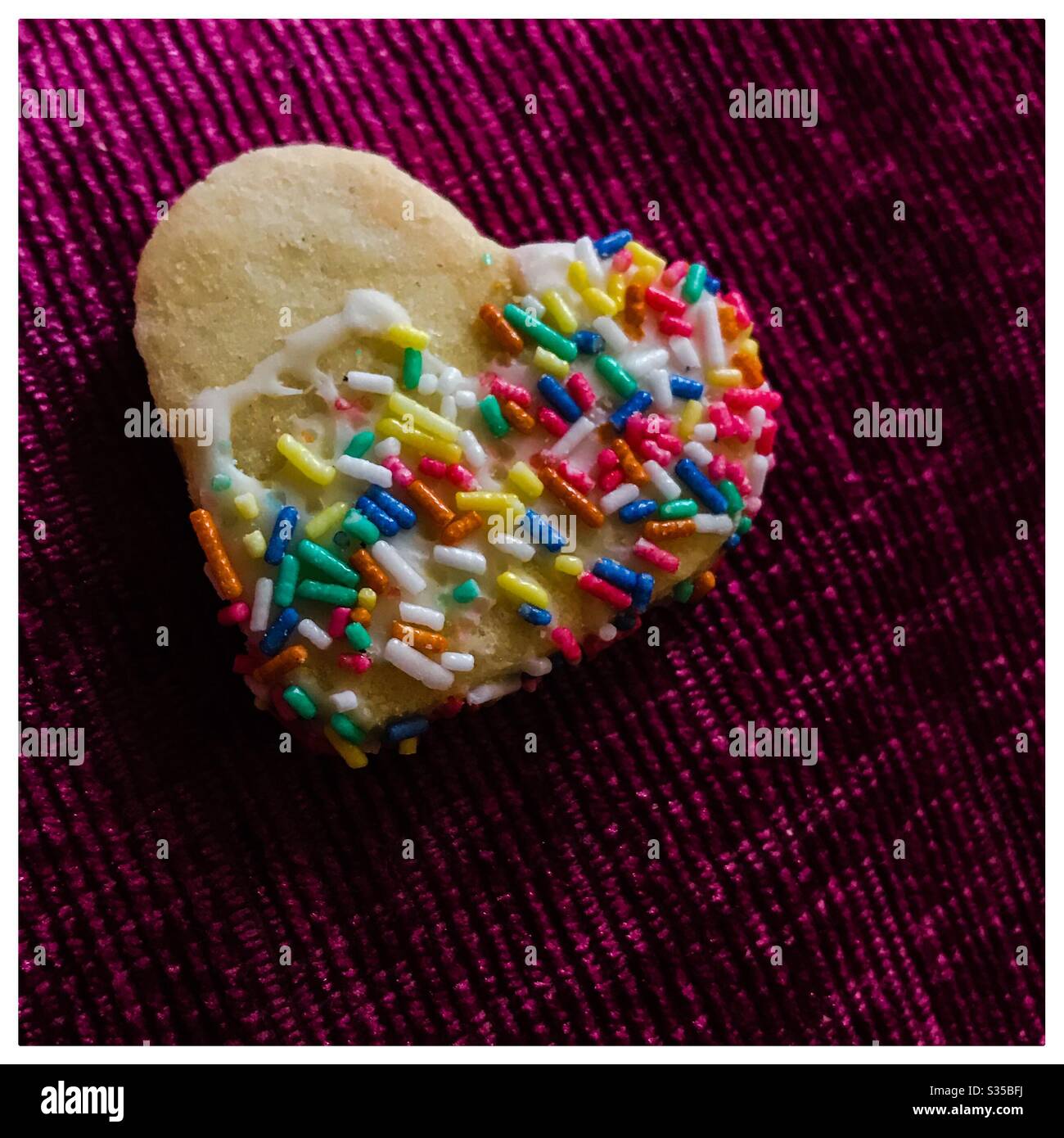 Rainbow heart biscuit Stock Photo - Alamy