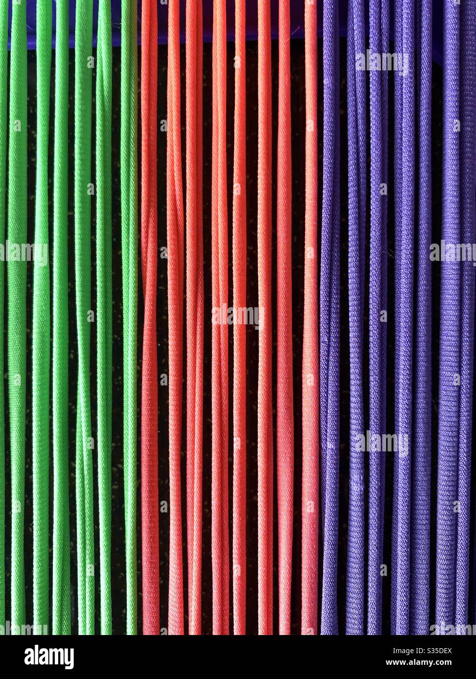 Colorful background of weaving threads Stock Photo - Alamy