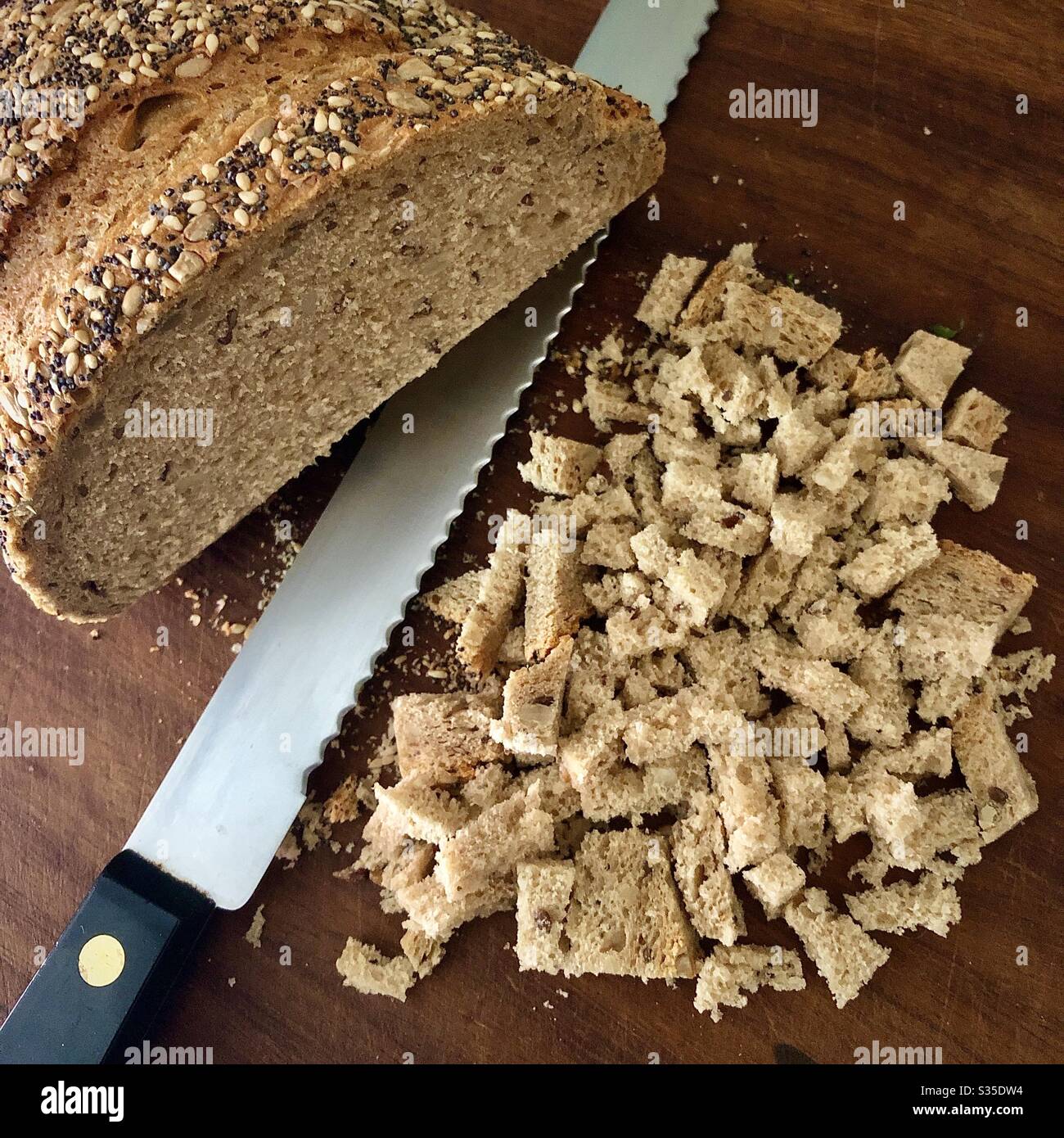Chopped wholemeal bread for feeding birds Stock Photo - Alamy