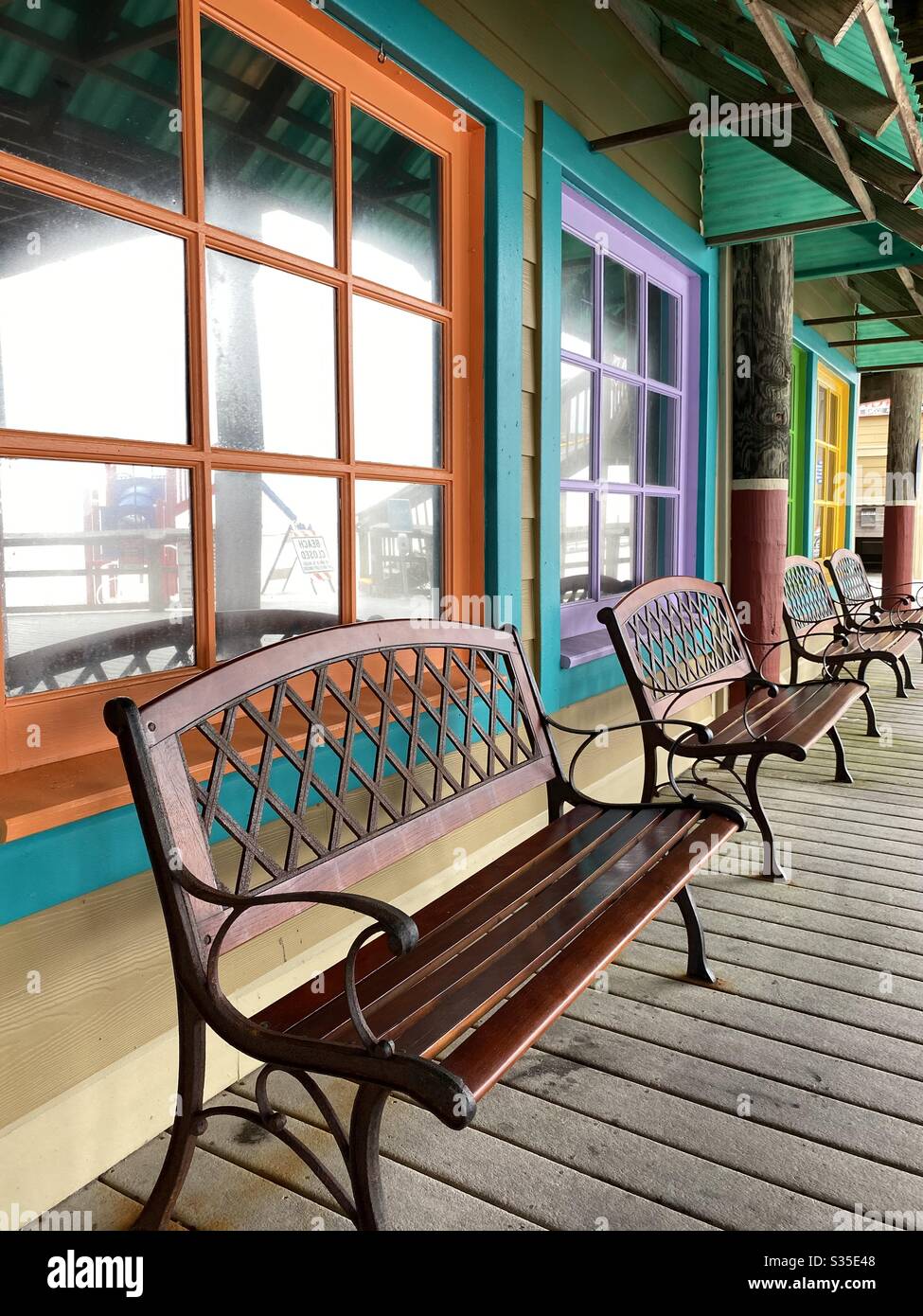 Colorful wall and benches Stock Photo - Alamy