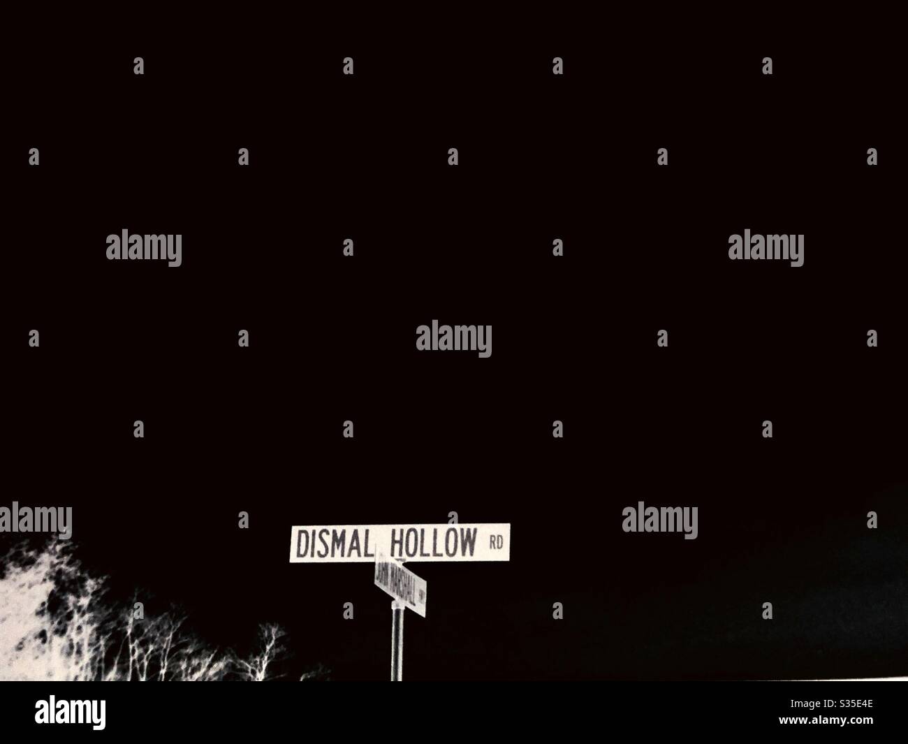 Street sign on highway small town America DIsmal Hollow on way to ...