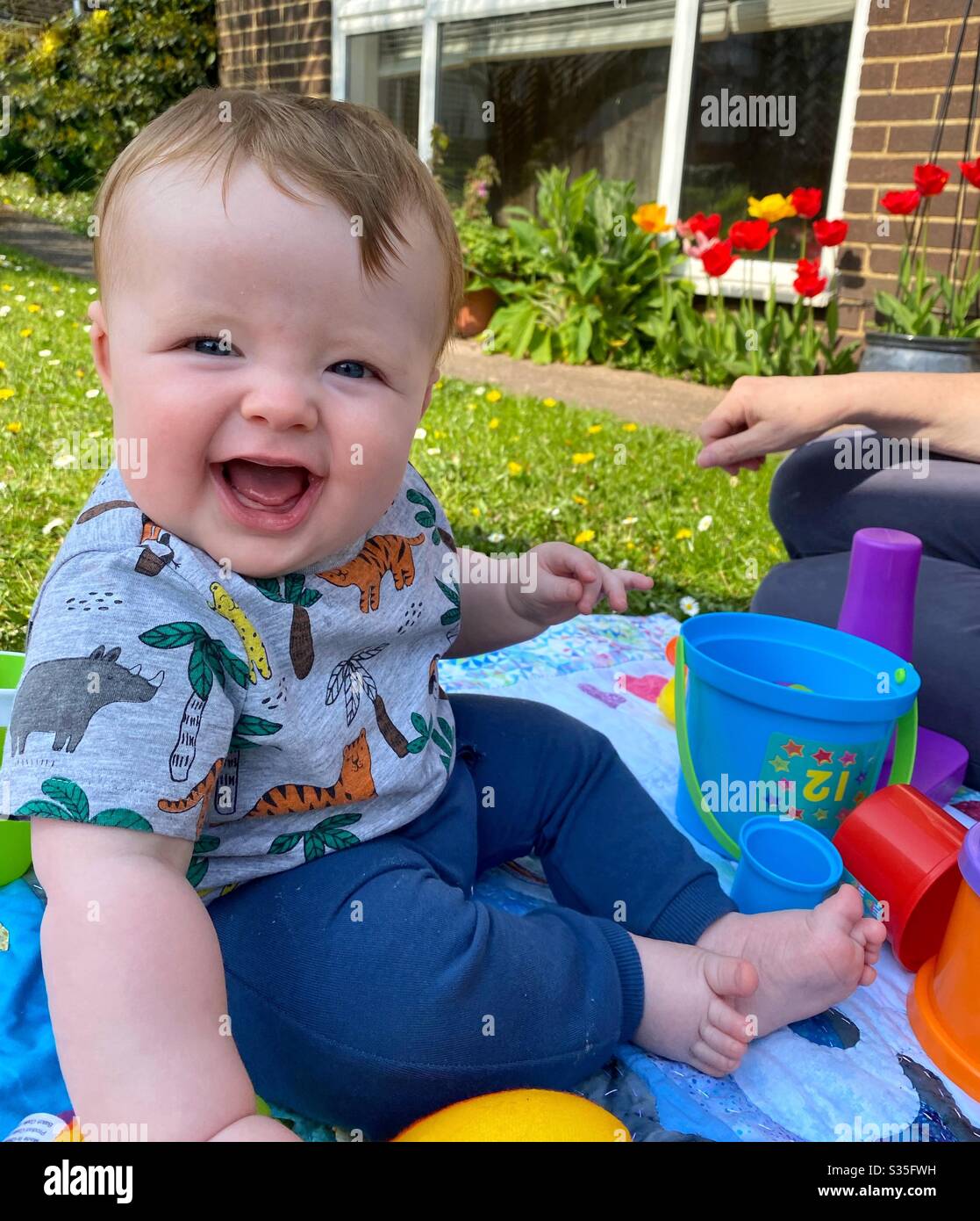 Little baby boy playing outside Stock Photo - Alamy