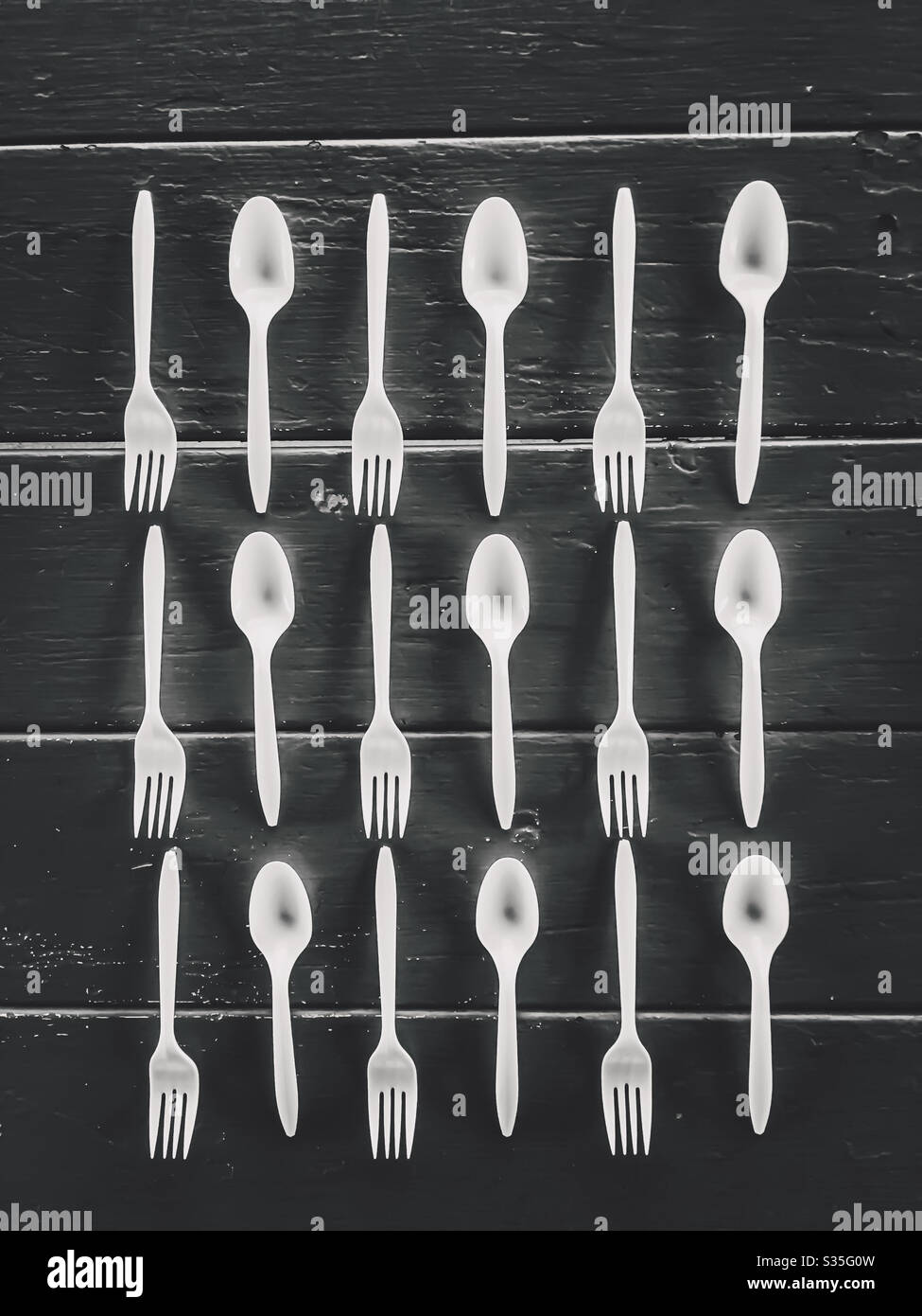Spoon and fork pattern on the wood table in black and white Stock Photo ...