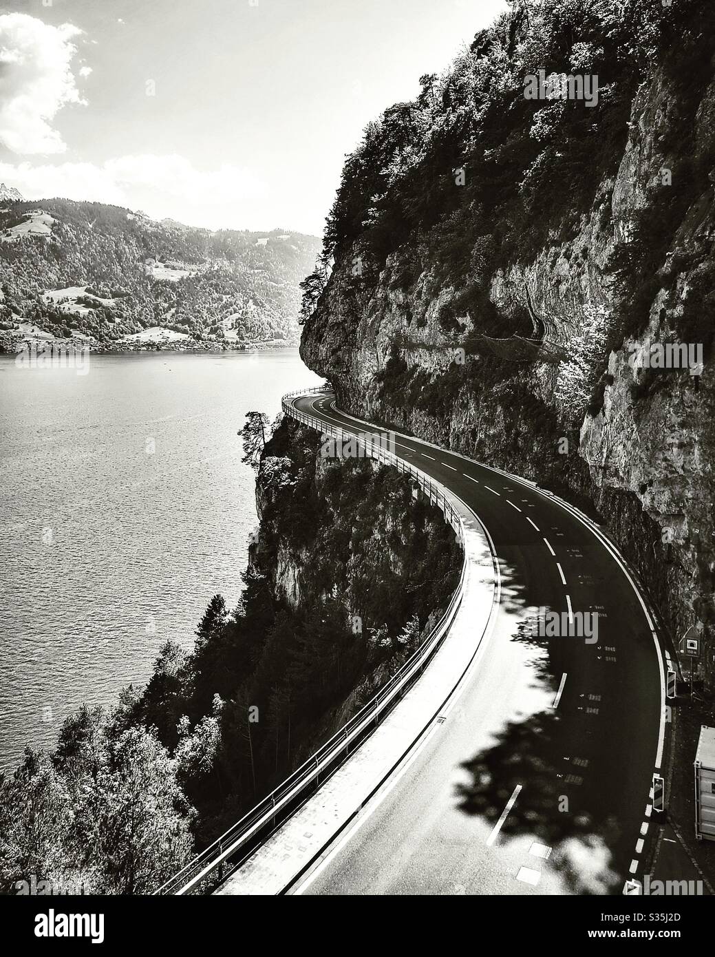 Lakeside road near Interlaken, Switzerland Stock Photo - Alamy