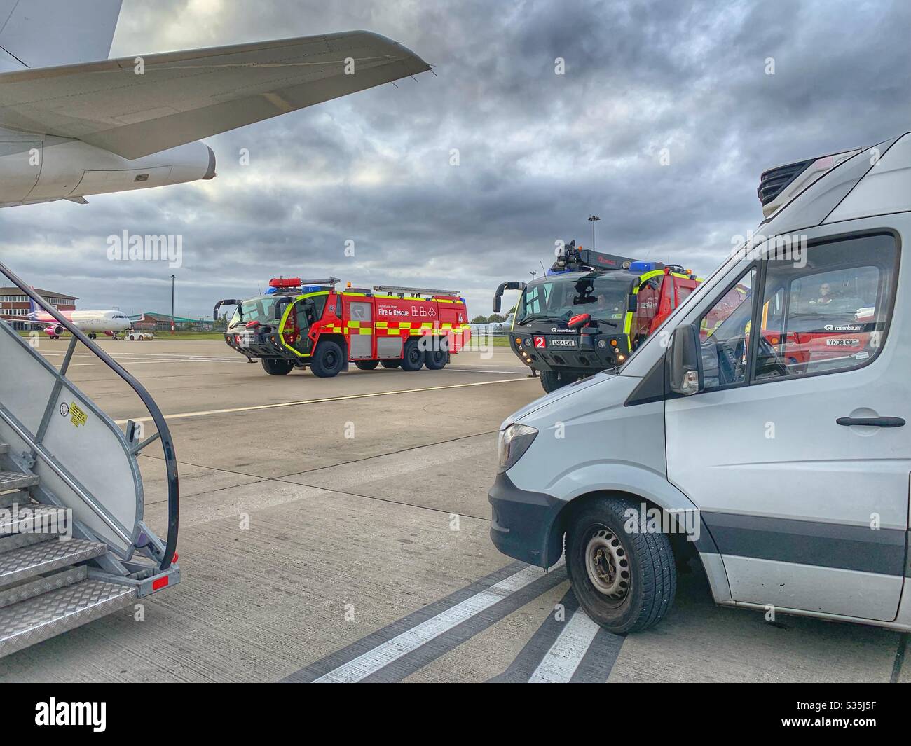 Airport fire engines responding to an emergency on the runway Stock ...