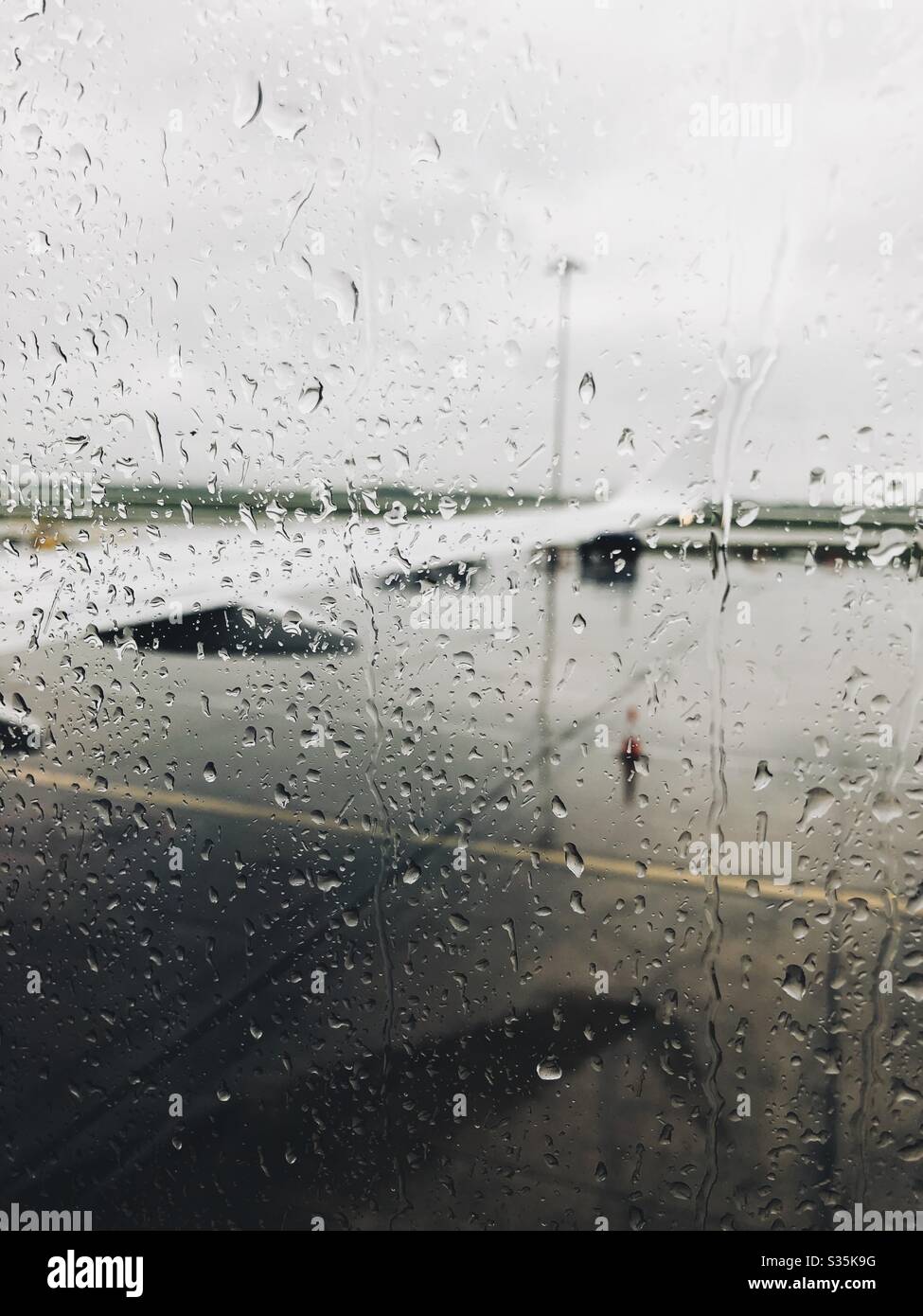 Rainy view from plane window Stock Photo - Alamy
