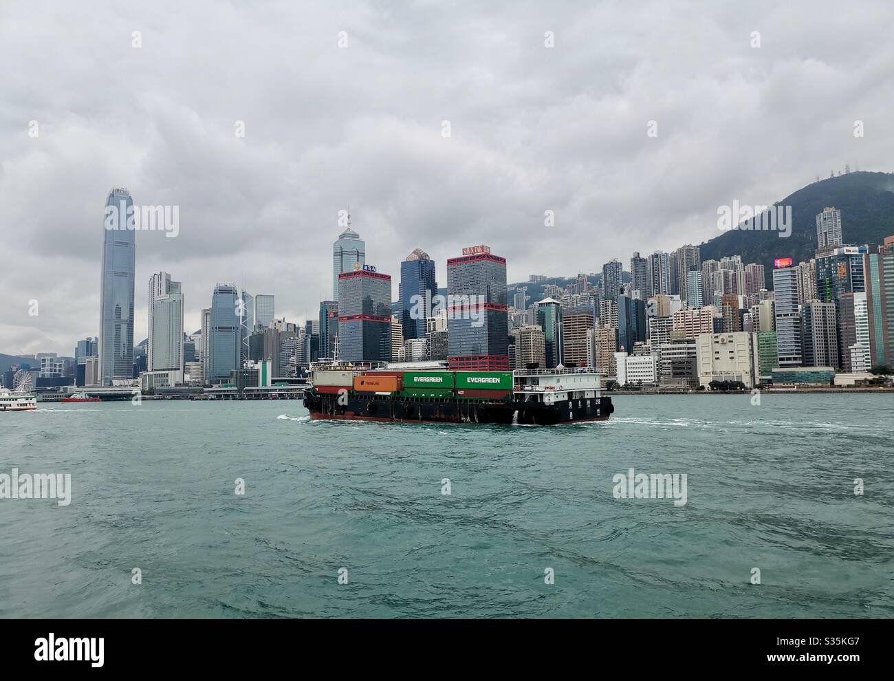 A container ship in Hong Kong’s Victoria harbour Stock Photo - Alamy
