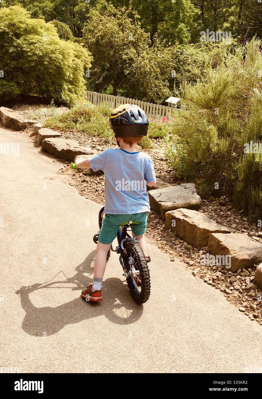 Young boy on a bicycle Stock Photo - Alamy