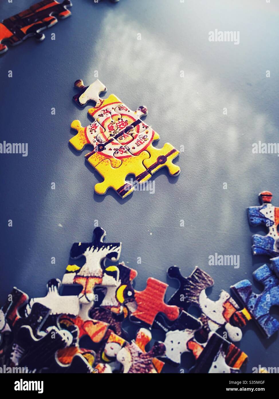 Still life of a jigsaw puzzle in progress of being assembled Stock ...