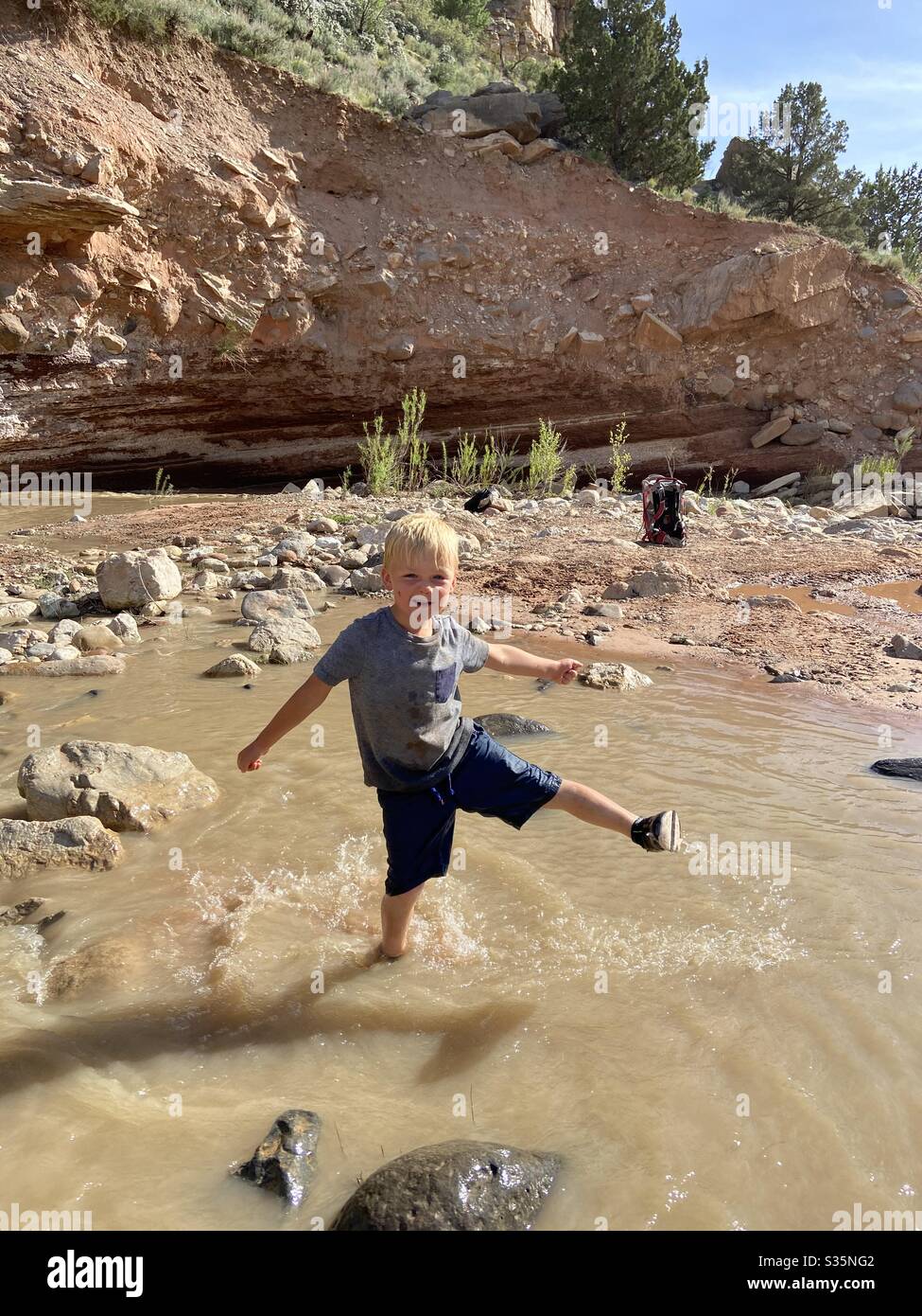Playing in the river Stock Photo - Alamy