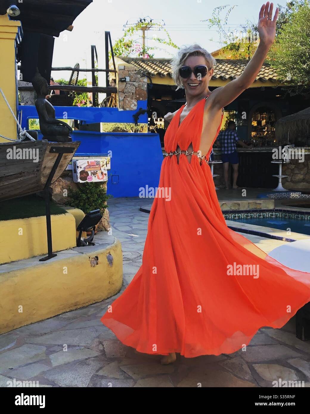 Woman dancing by pool atPikes Ibiza Stock Photo - Alamy